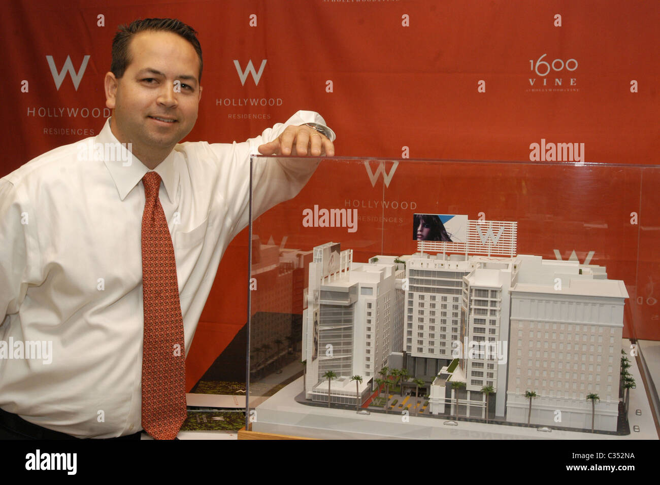 Scott Ryder poses with a W hotel model Hollywood Chamber Of Commerce ...