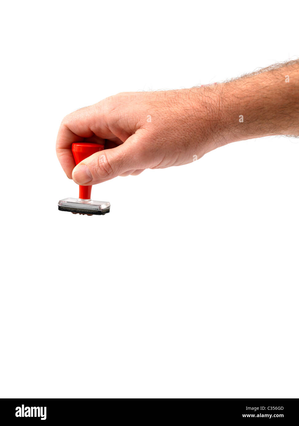 A rubber stamp hand held isolated against a white background Stock ...