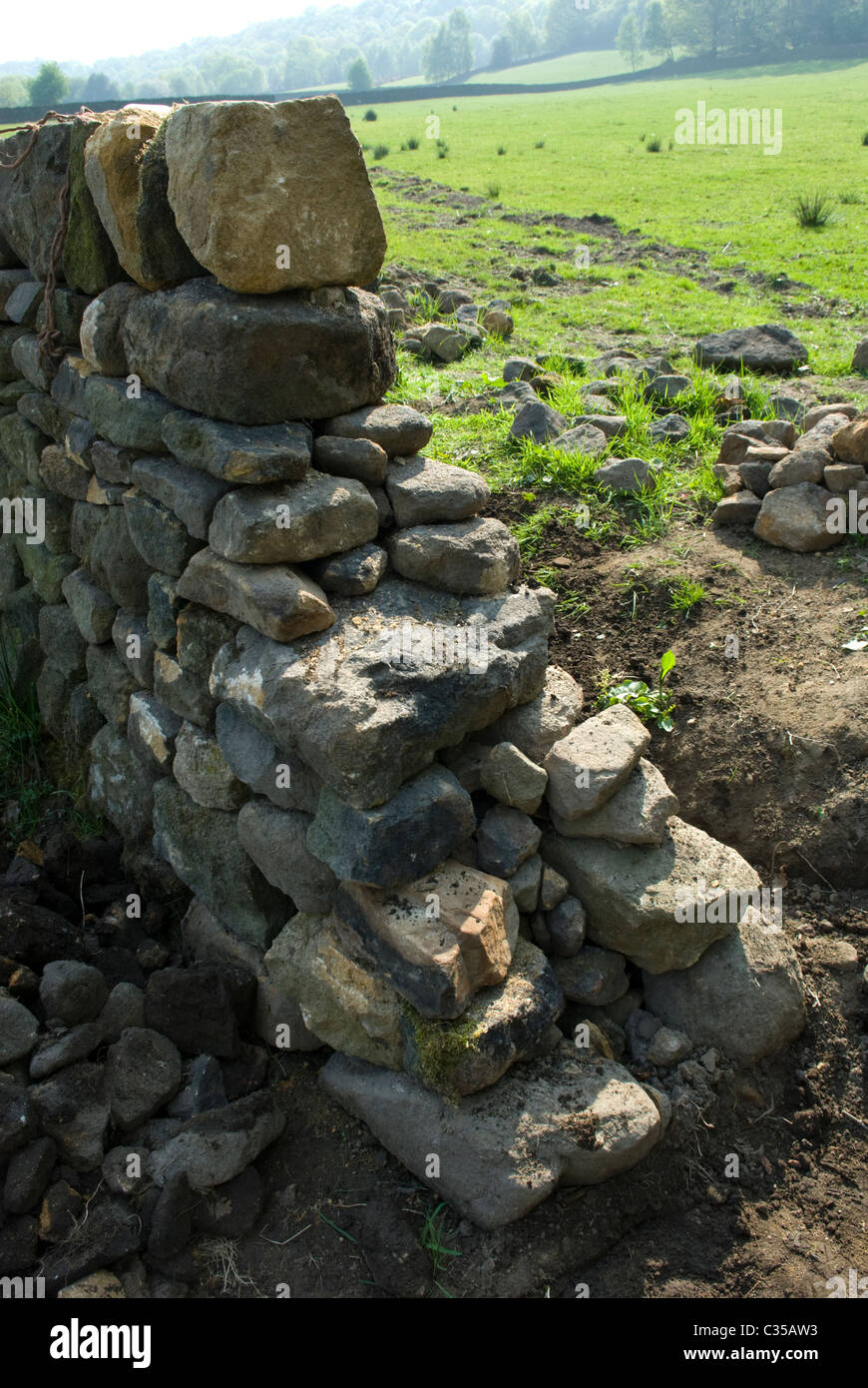 A cross section of a dry stone wall, showing the batter Stock Photo - Alamy