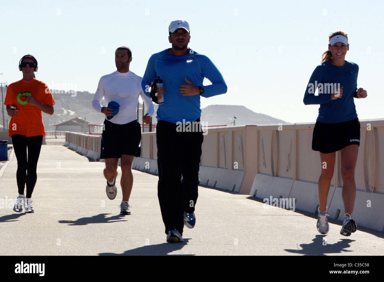 Katie Price and Peter Andre seen jogging at the beach with friends. Los ...