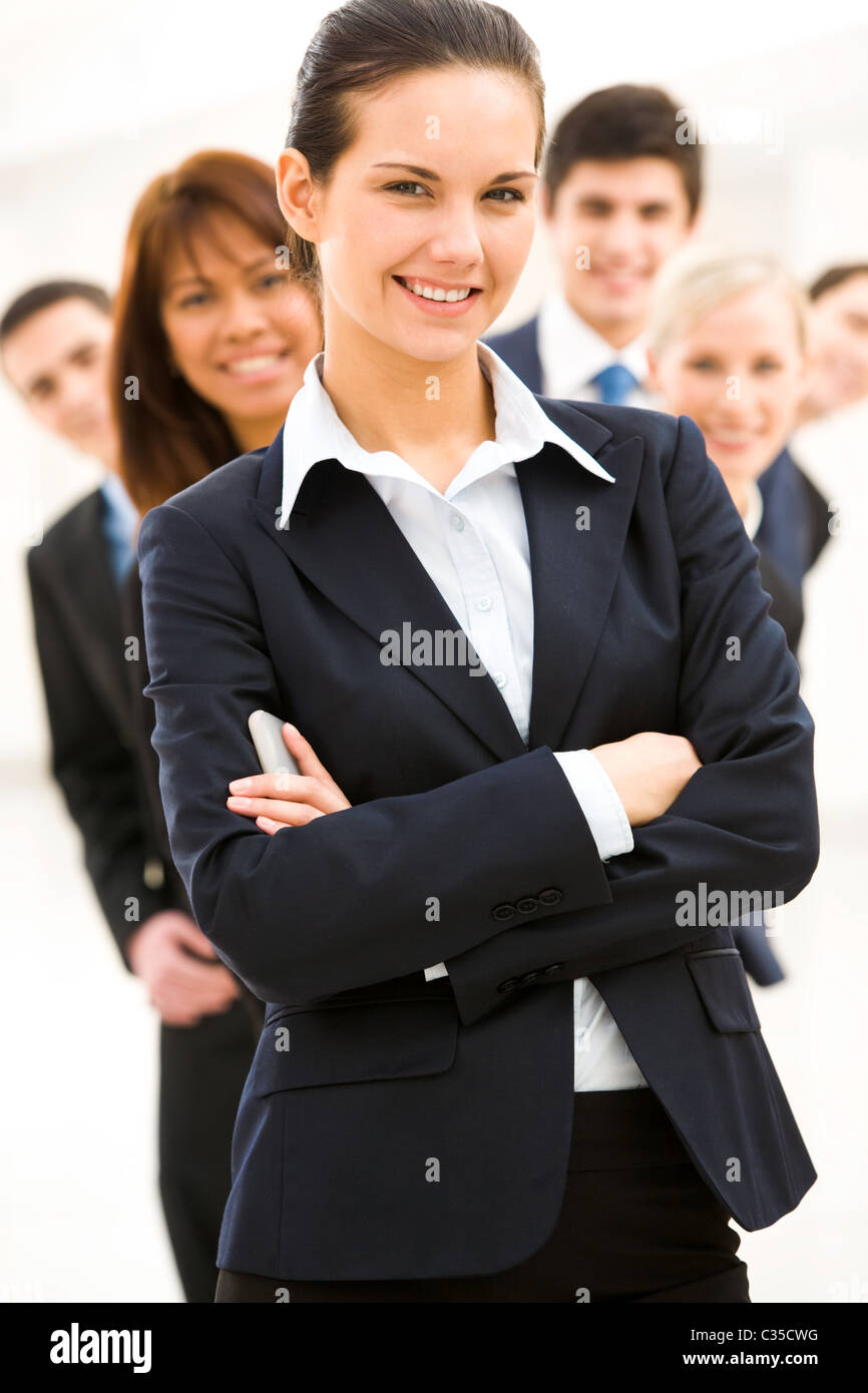 Portrait of successful businesswoman looking at camera on background of ...
