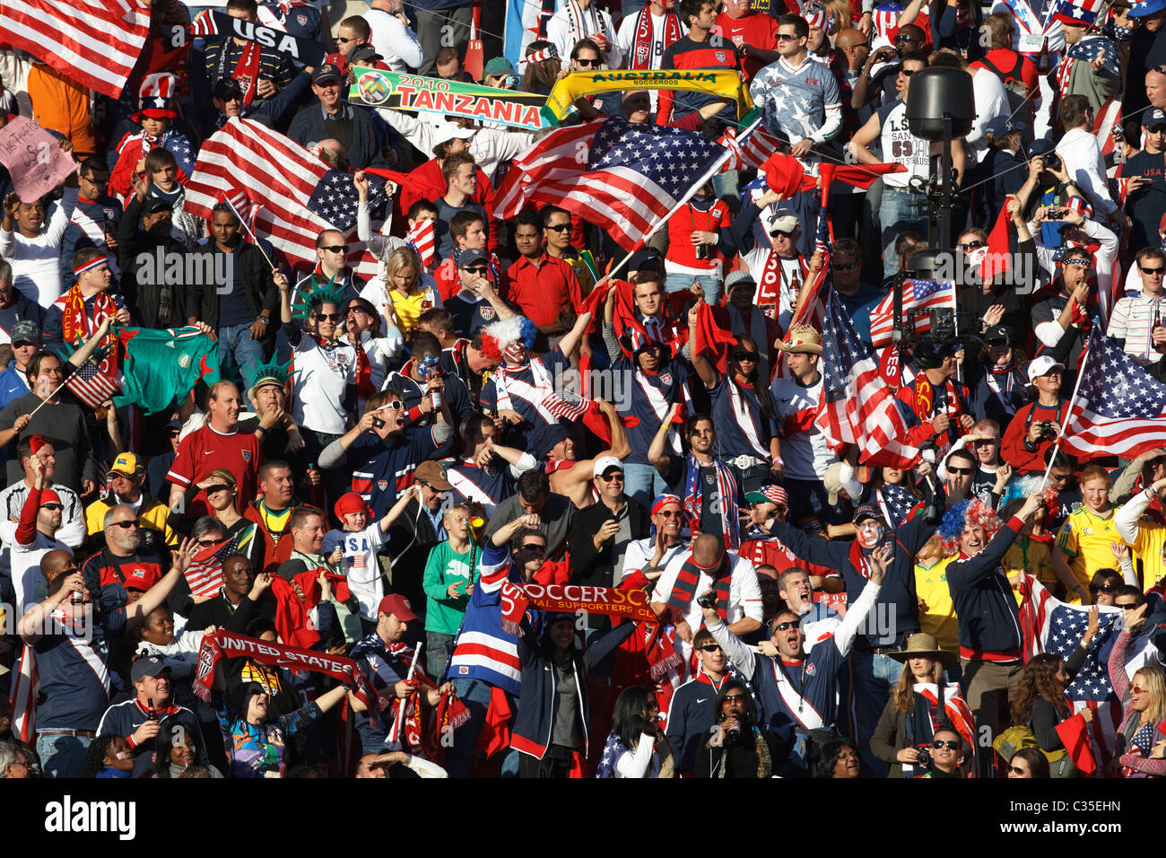 Spectators cheer at a FIFA World Cup Group C match between Slovenia and ...