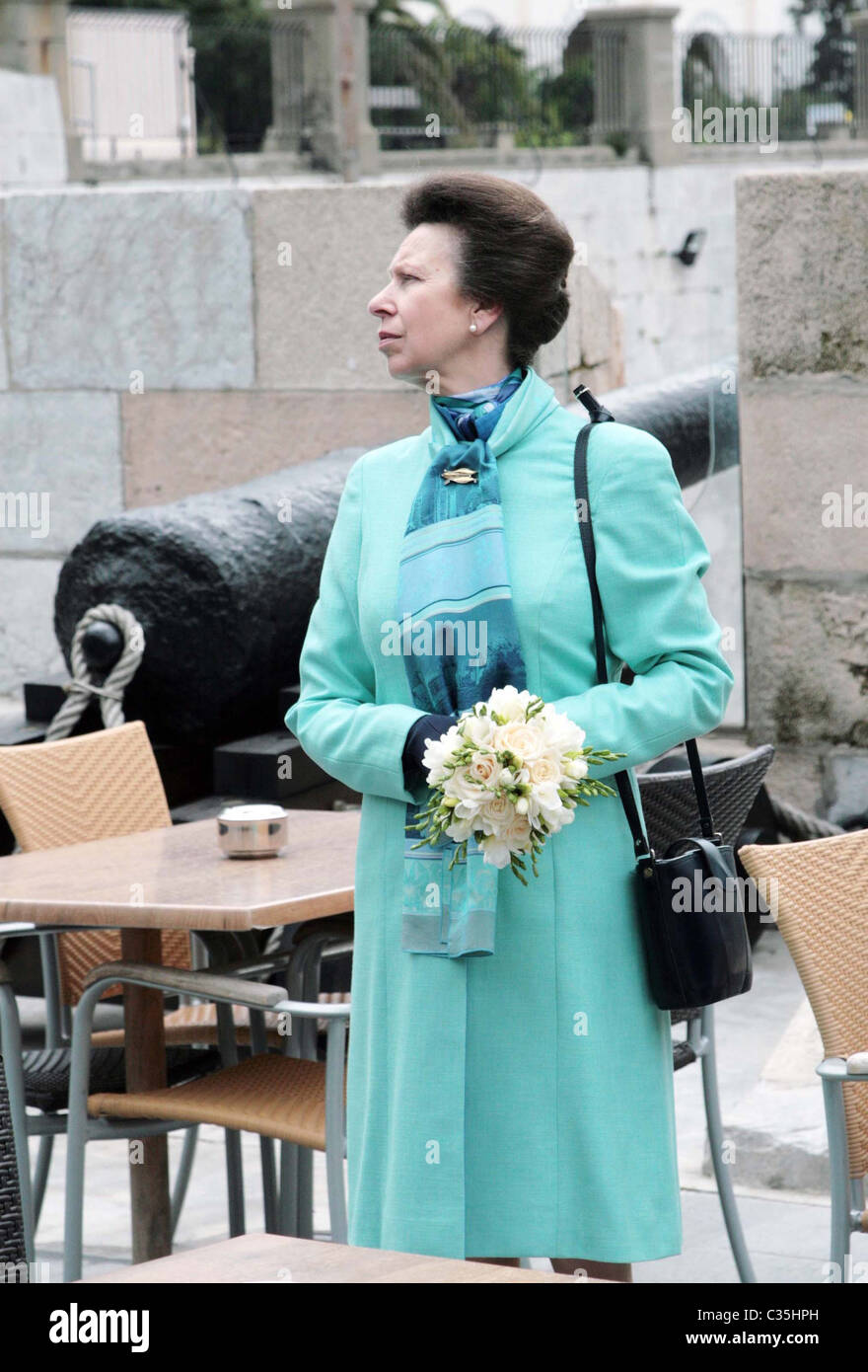 Britain's Princess Anne receives flowers from children during her visit ...