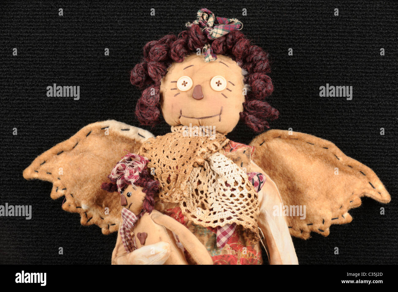 Rag doll angel with wings in half body close up with buttons for eyes ...