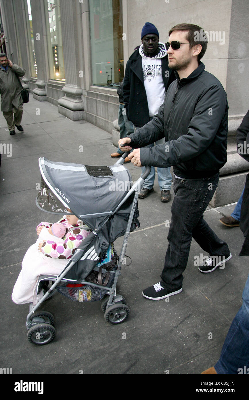 Tobey Maguire pushes a stroller with his daughter Ruby Maguire as they ...