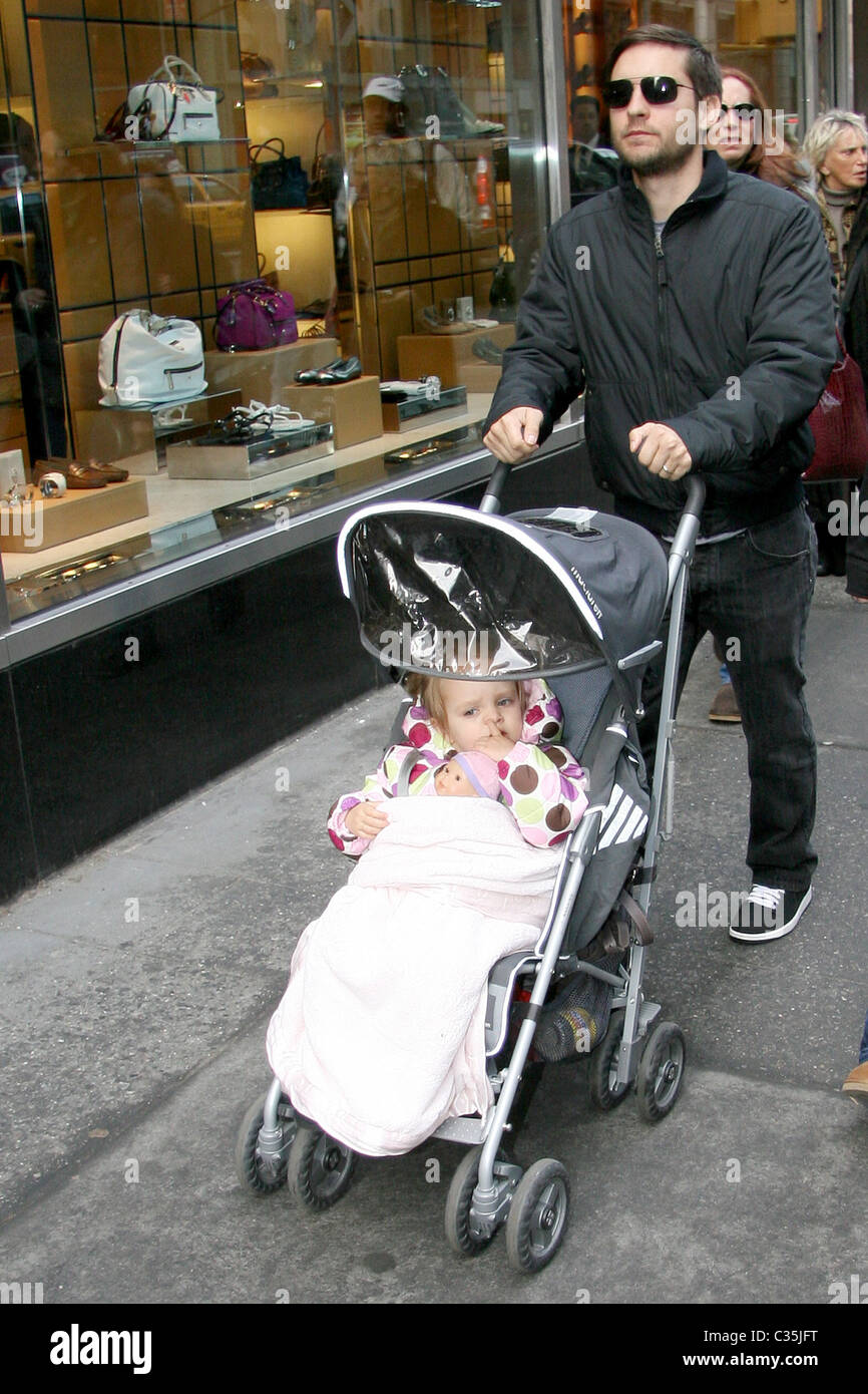 Tobey Maguire pushes a stroller with his daughter Ruby Maguire as they ...