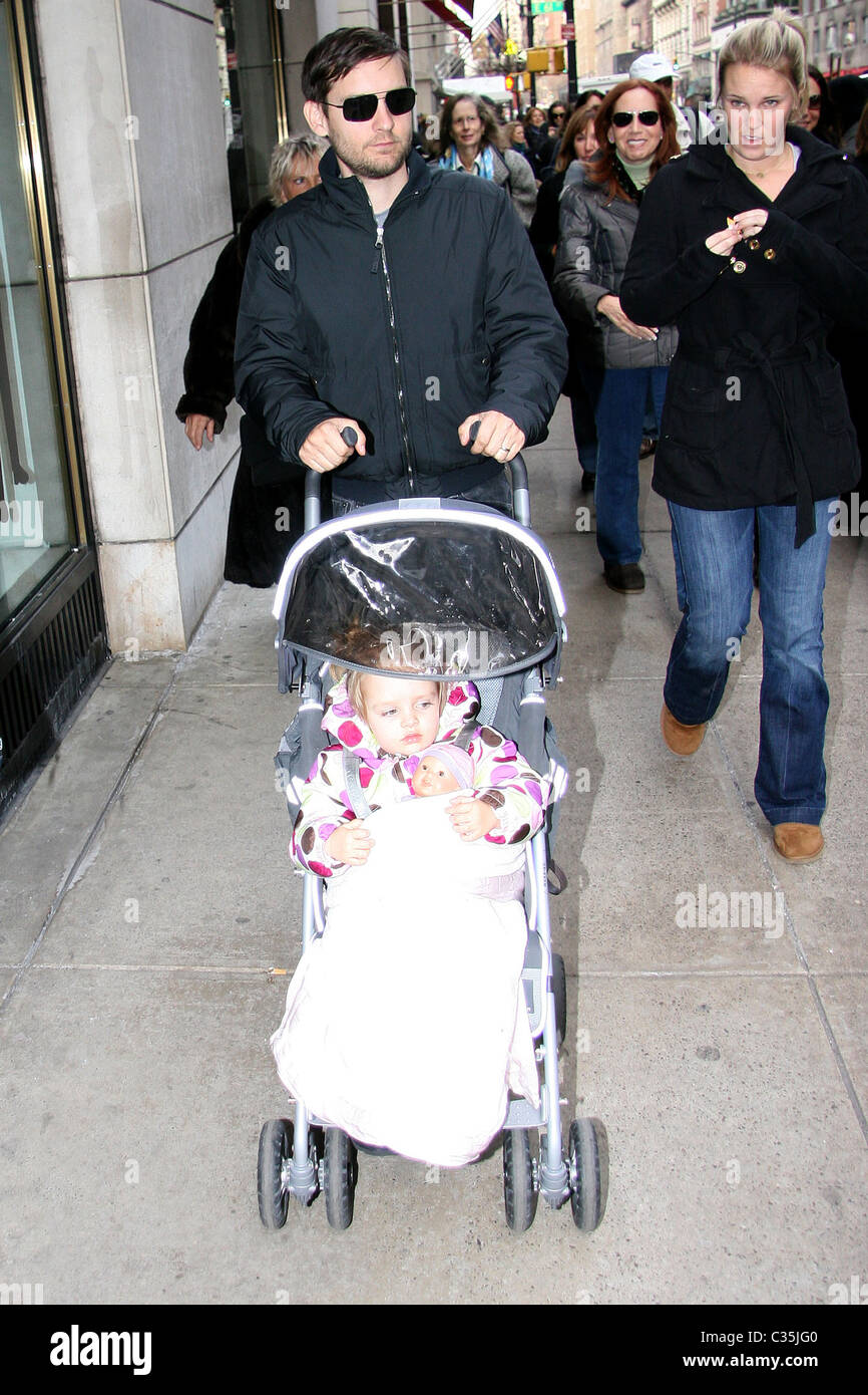 Tobey Maguire pushes a stroller with his daughter Ruby Maguire as they ...