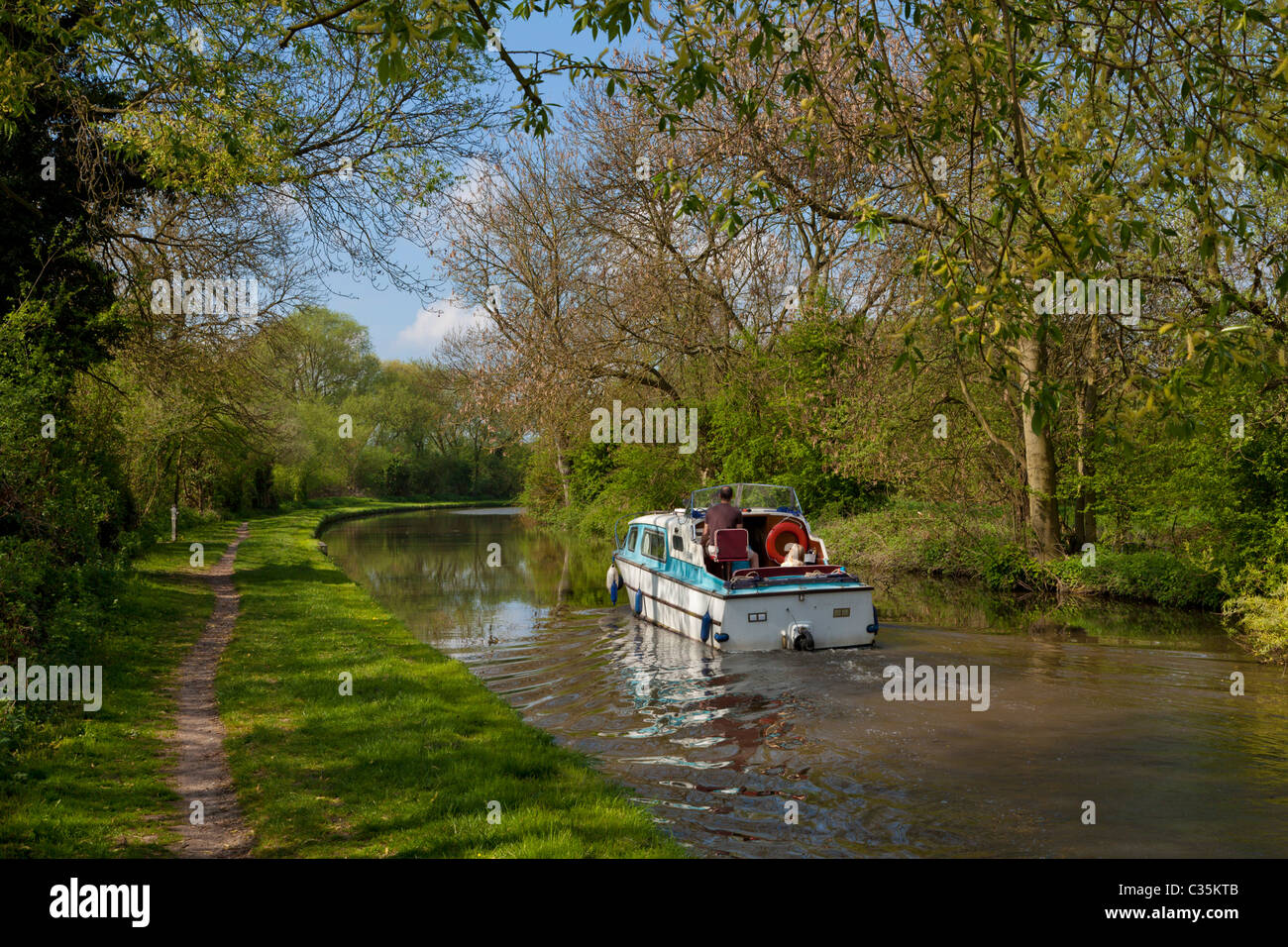 Small motor boat on the Trent and Mersey Canal near Aston on Trent ...