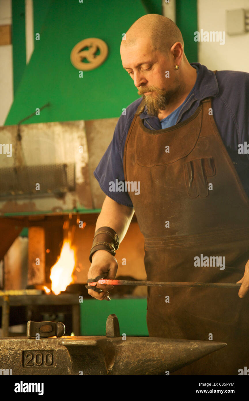 Blacksmith Andrea Iori at work in his forge Maso Stralleri, Roncegno ...