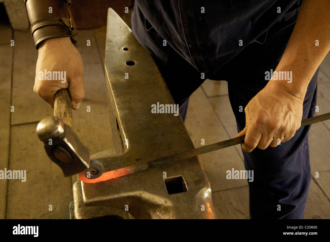 Blacksmith Andrea Iori at work in his forge Maso Stralleri, Roncegno ...
