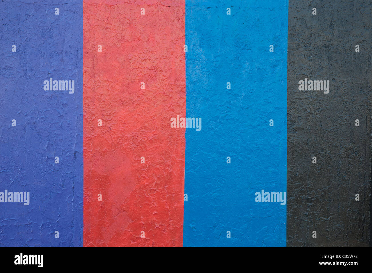 Four color stripes painted on a wall Stock Photo - Alamy