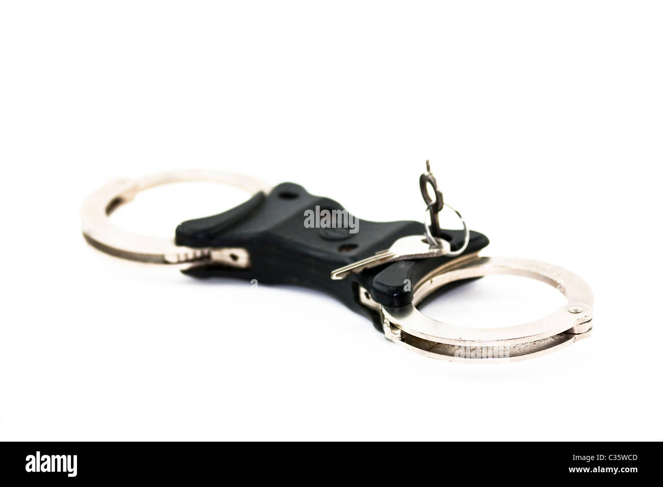 isolated handcuffs on white background simply shot Stock Photo - Alamy