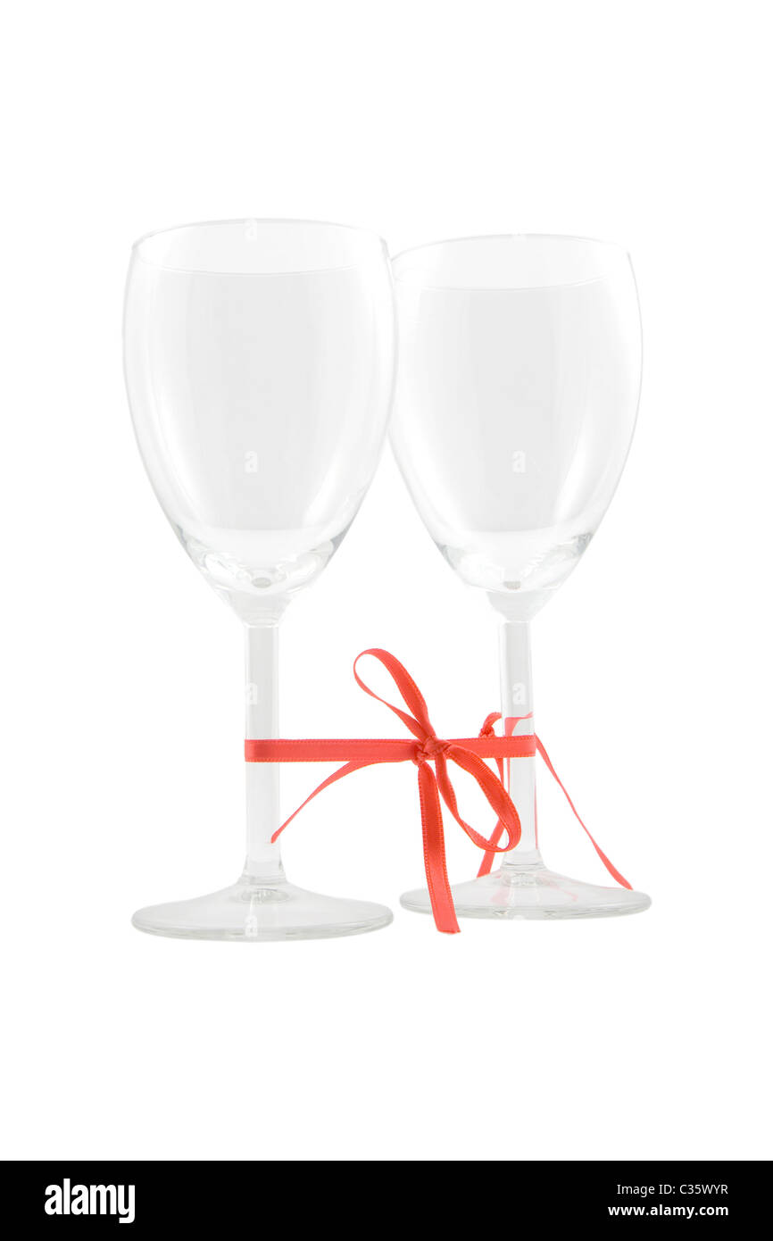 two empty glasses bounded with red ribbon Stock Photo - Alamy