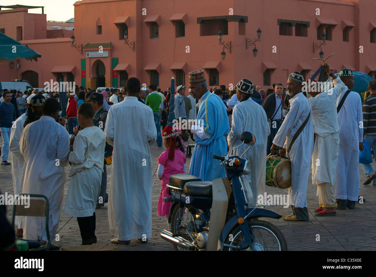 Street performers and musicians gathering at dusk in the Djemaa el Fna ...