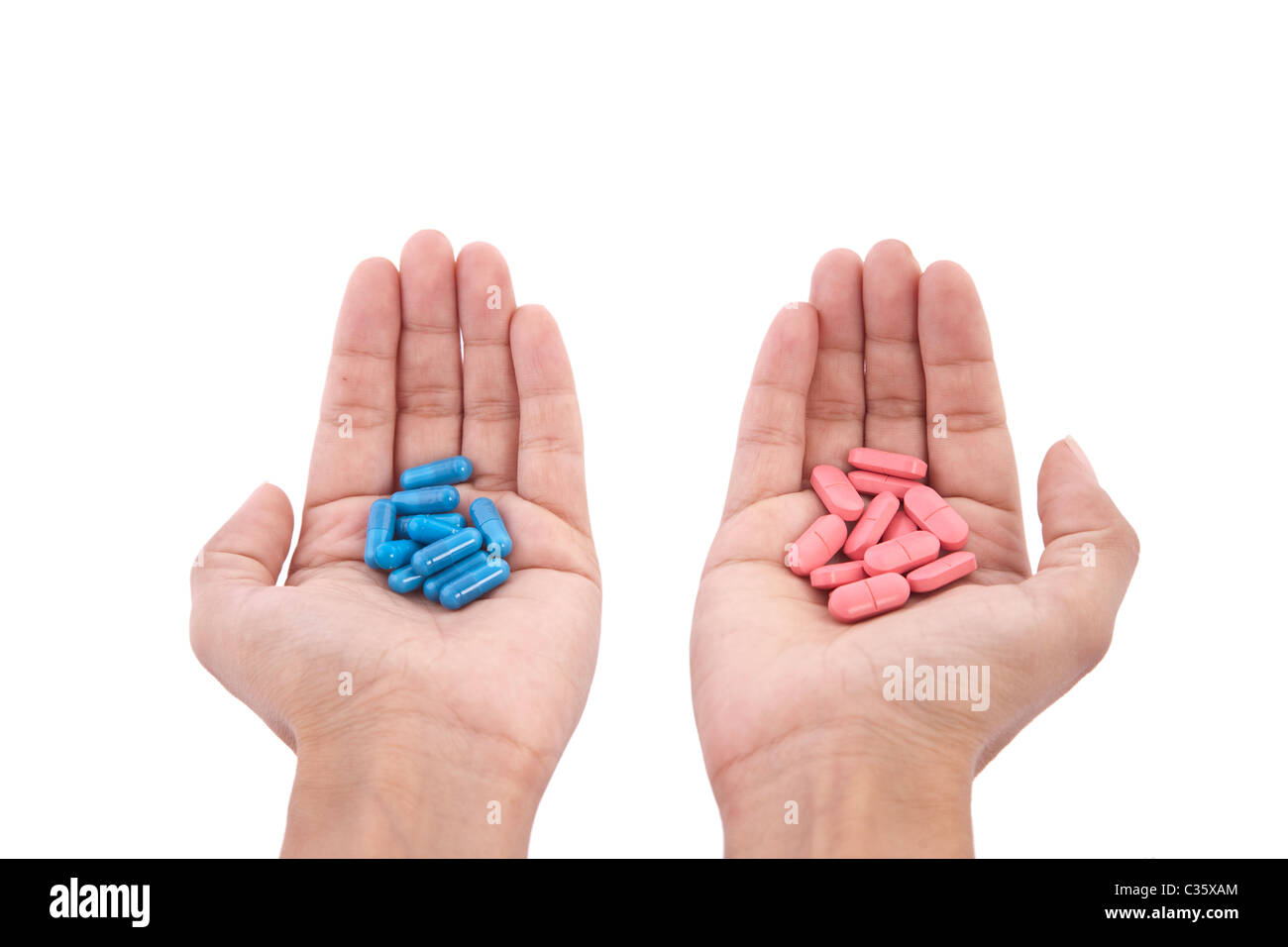 pills in hands isolated on white background Stock Photo - Alamy