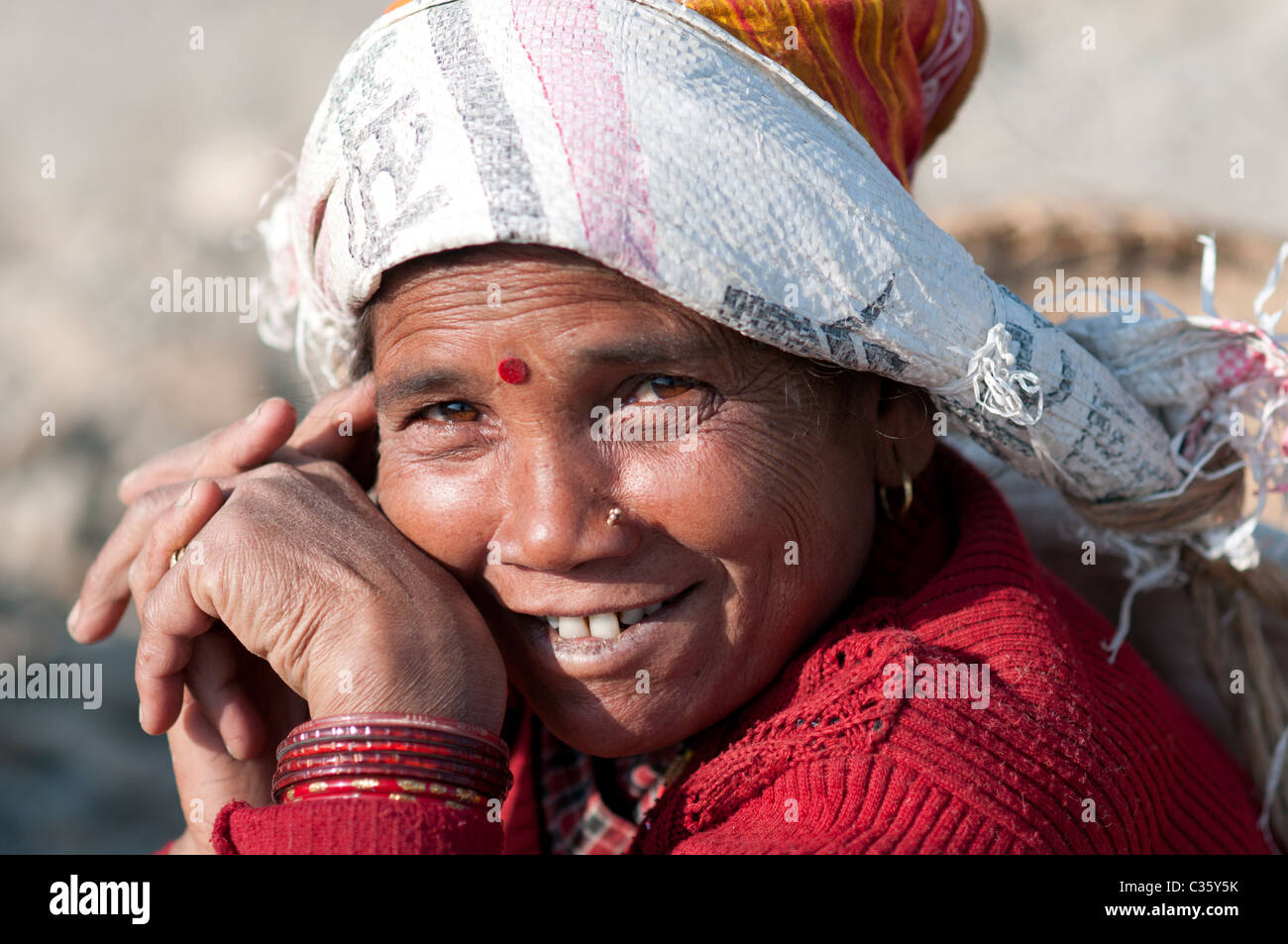 Nepali woman carrying rocks in the Kathmandu district Stock Photo - Alamy