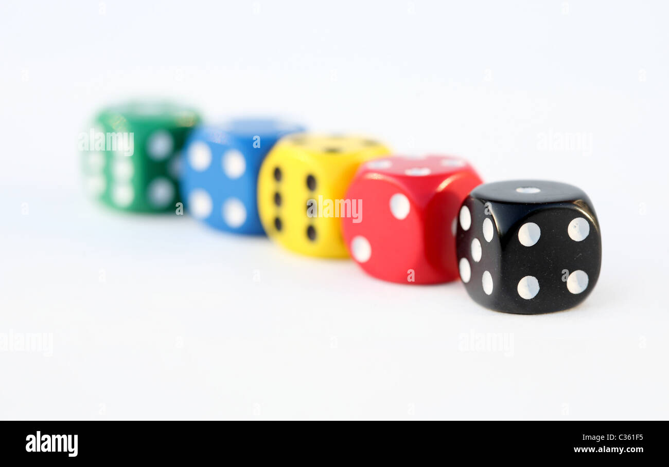 Multi colored dice in a diagonal row Stock Photo - Alamy
