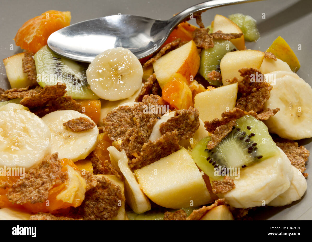 Vibrant fresh Fruit salad and bran flakes Stock Photo - Alamy