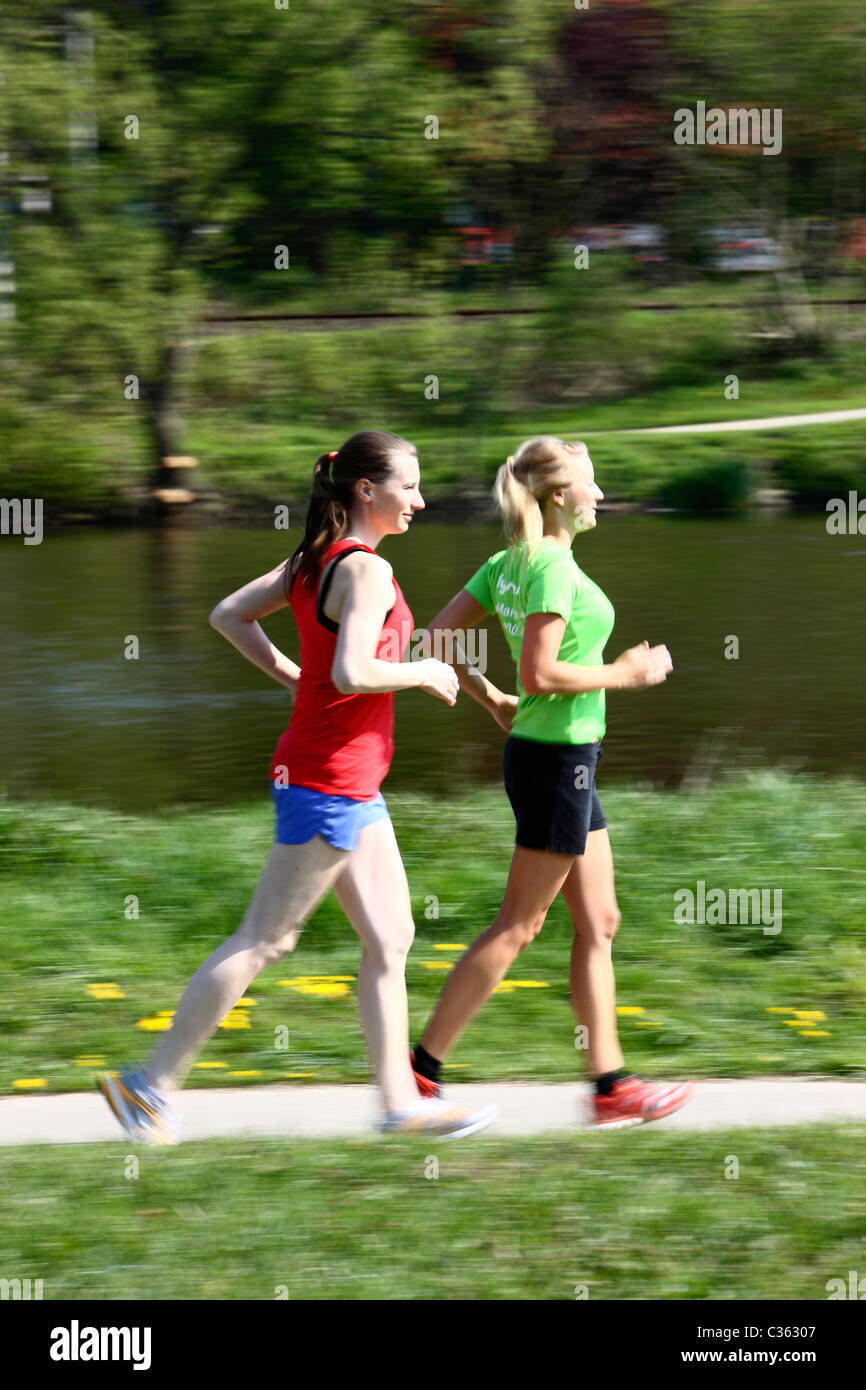 Two female hobby runners. Jogging in nature, in summer Stock Photo - Alamy