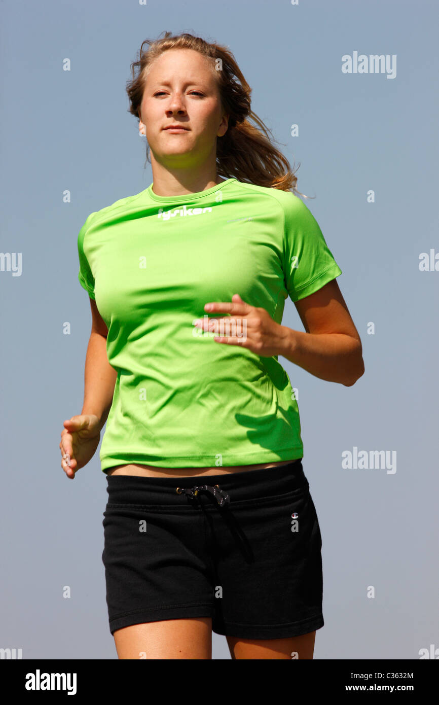 Female hobby runner. Jogging in nature Stock Photo - Alamy