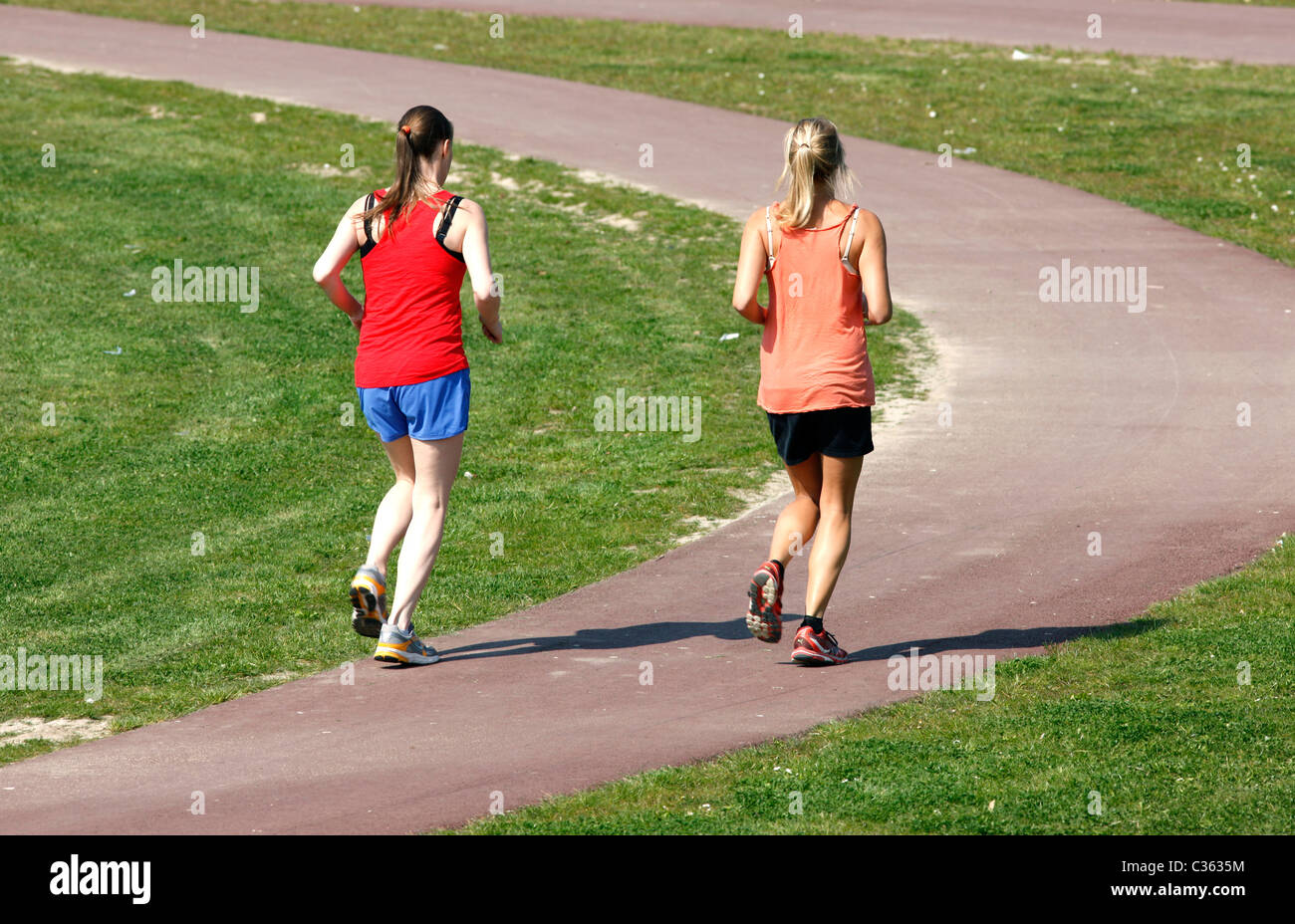 Two female hobby runners. Jogging in nature, in summer Stock Photo - Alamy
