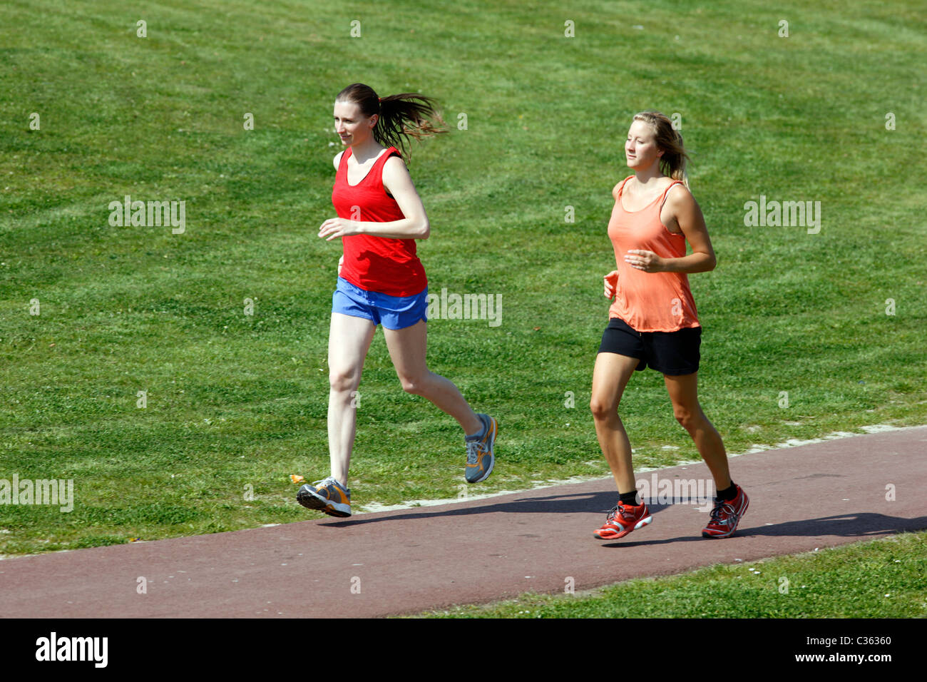 Two female hobby runners. Jogging in nature, in summer Stock Photo - Alamy