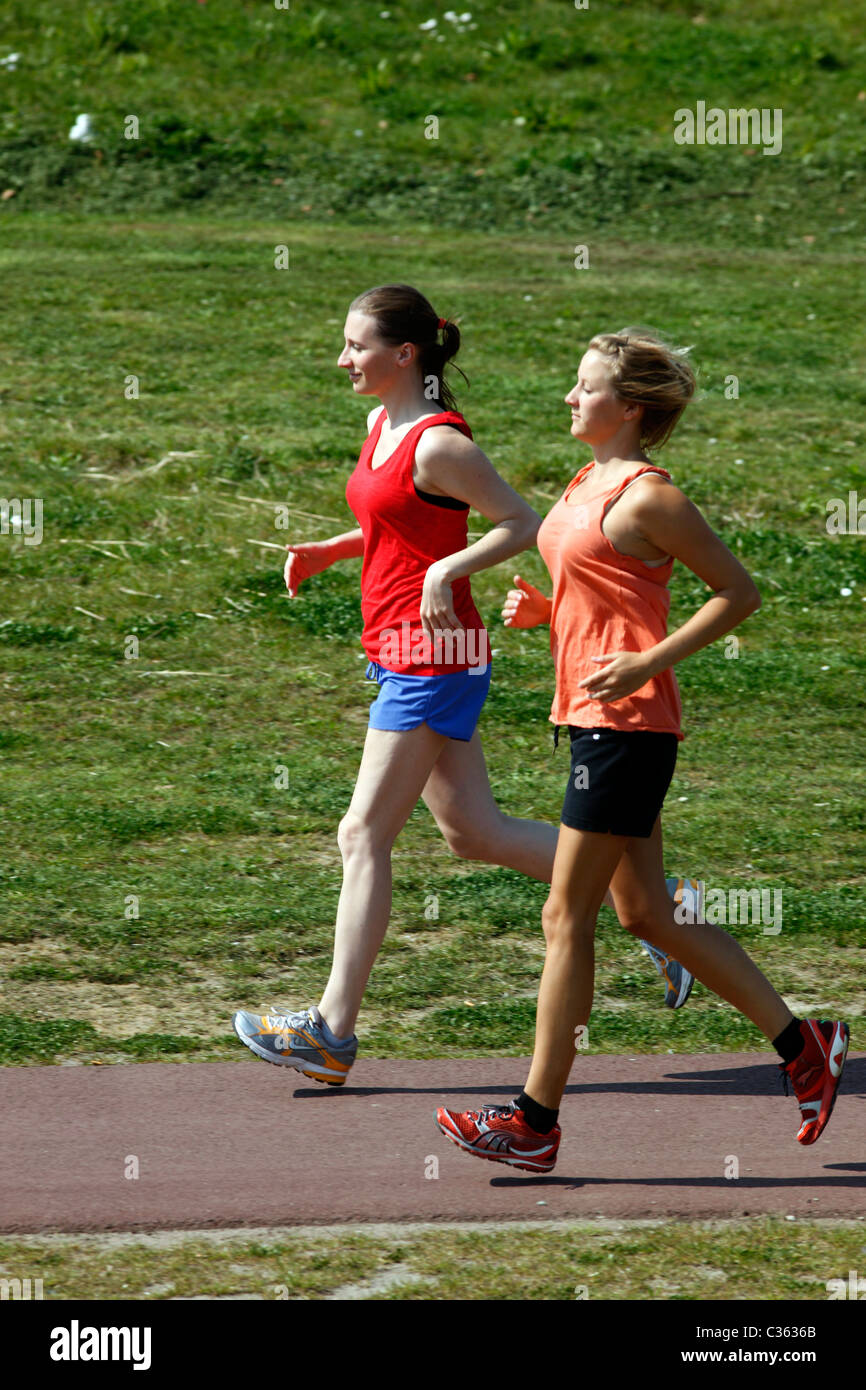 Two female hobby runners. Jogging in nature, in summer Stock Photo - Alamy