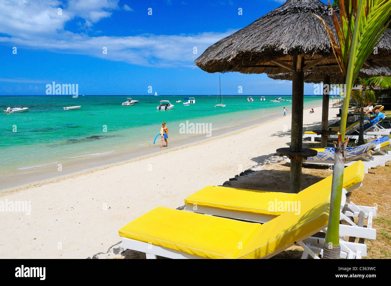 Directly located at the public beach are the hotel lawn chairs of the ...