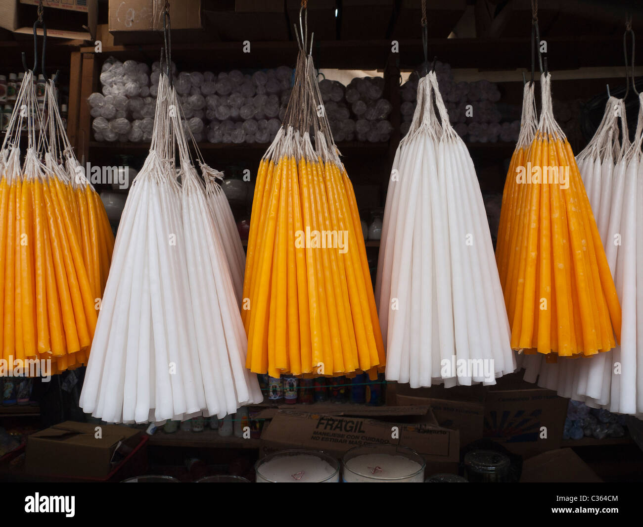 Traditional candles used to light and honor ancestors hang for sale in ...