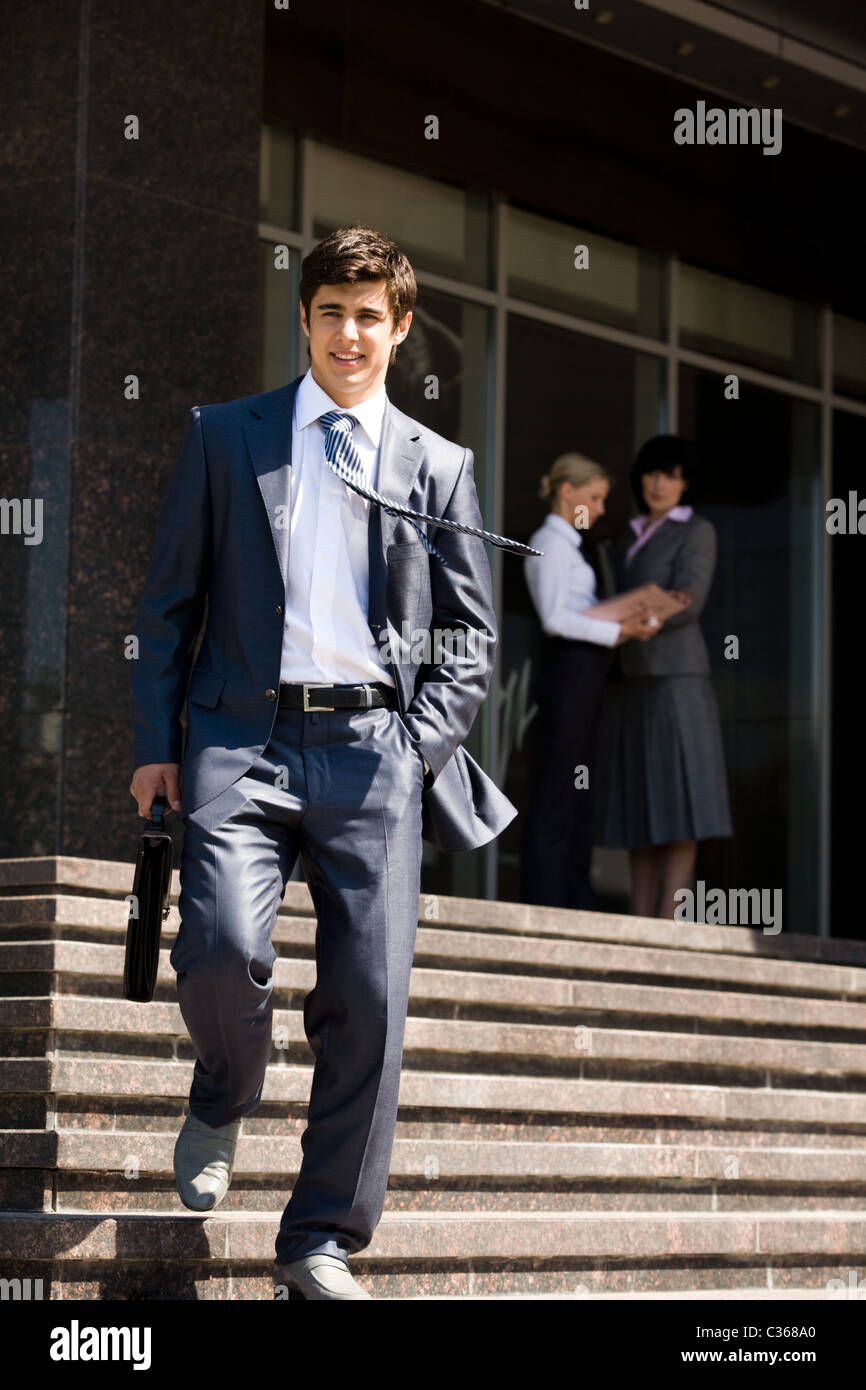 Man woman behind walking suit hi-res stock photography and images - Alamy