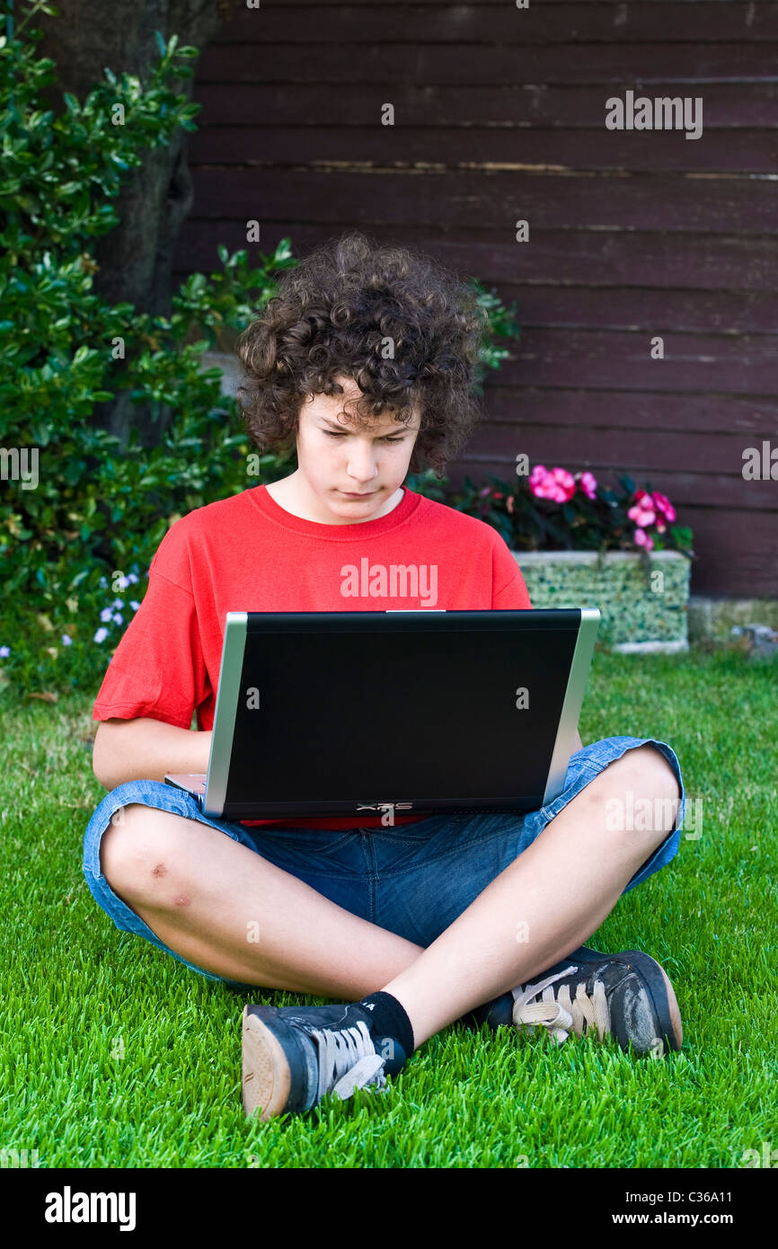 Boy with laptop Stock Photo - Alamy