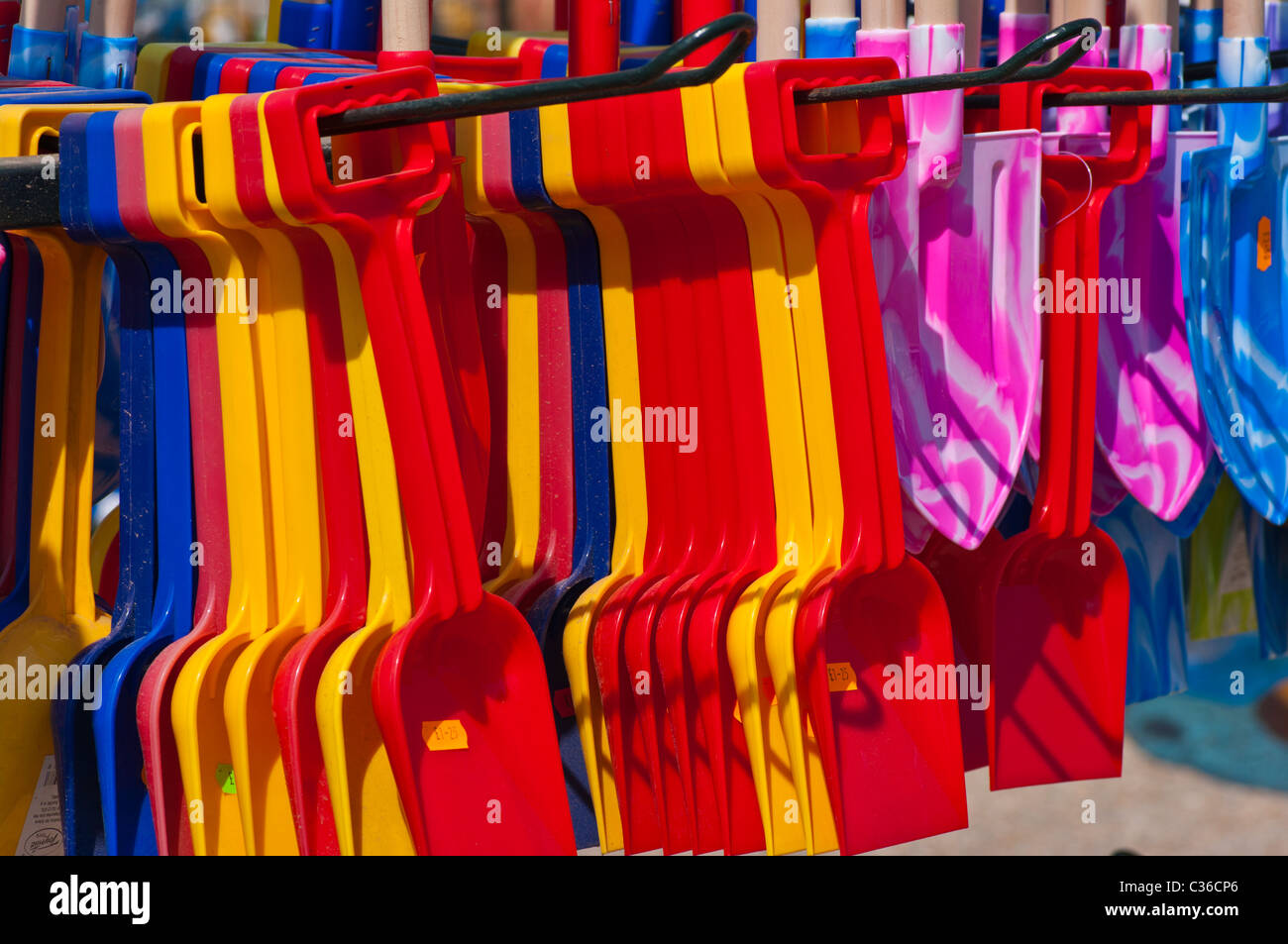 Colourful Plastic Beach Spades Stock Photo - Alamy
