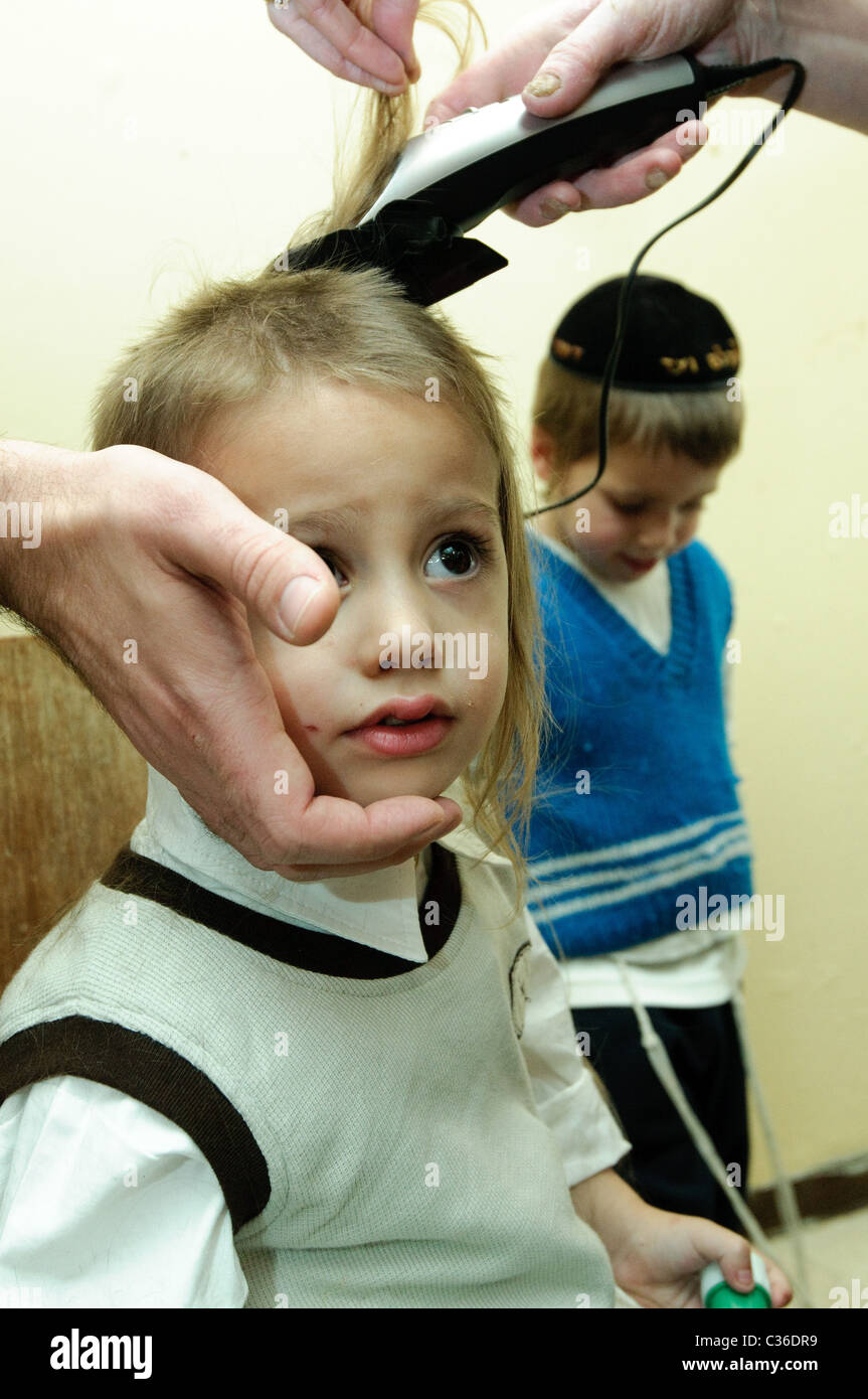 Shalev, Young Jewish boy of three having his first ritual haircut ...
