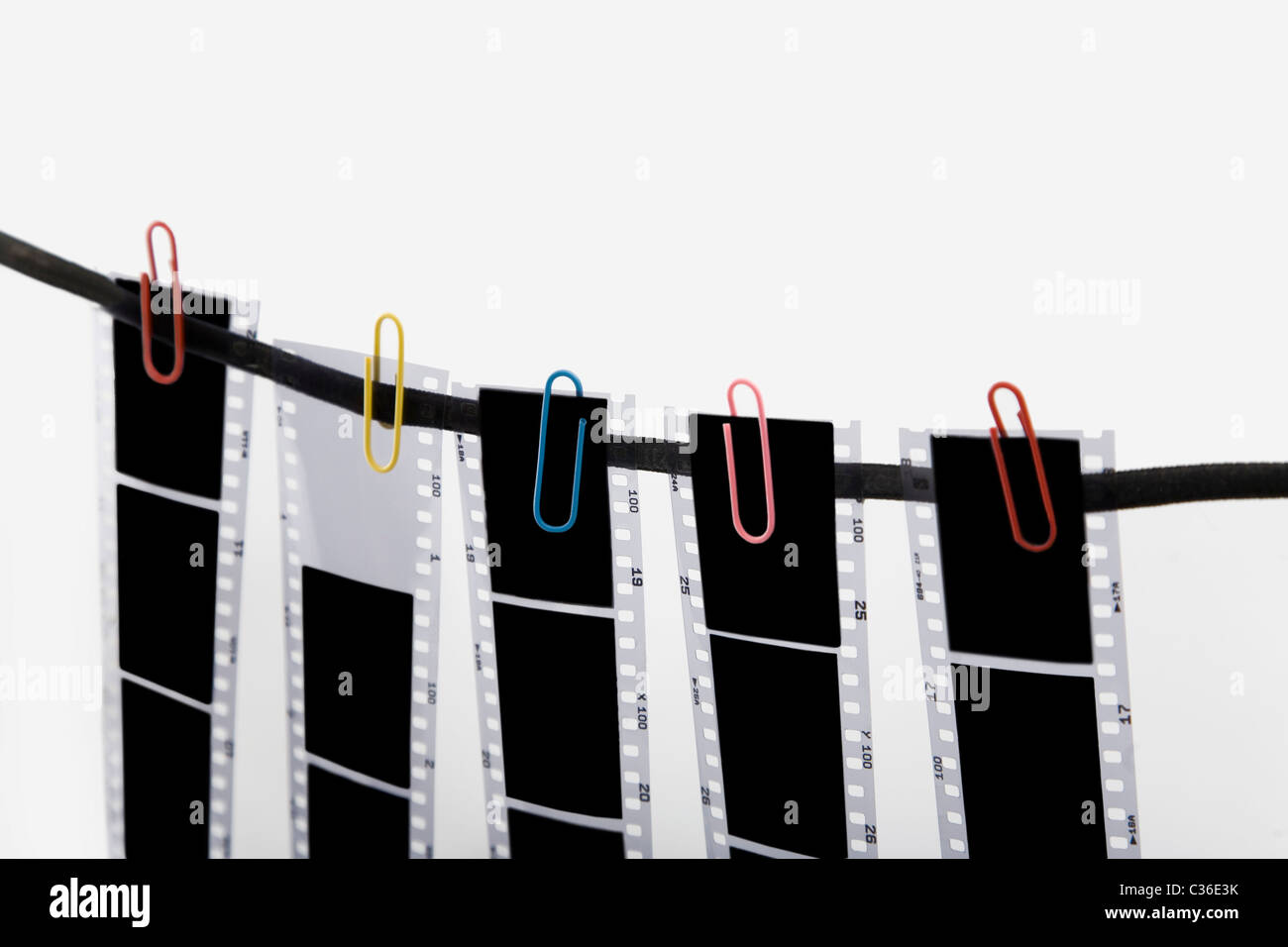 five film strip and colored paper clip Stock Photo - Alamy