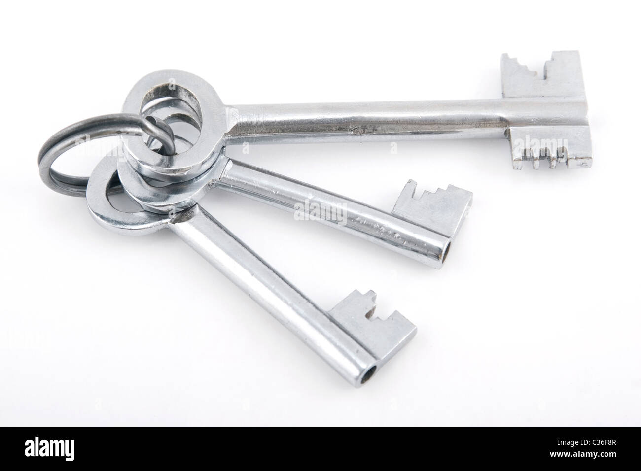 silver bunch of keys on white background Stock Photo - Alamy