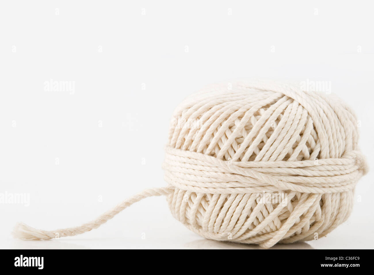 closeup from white ball of twine, front view Stock Photo - Alamy