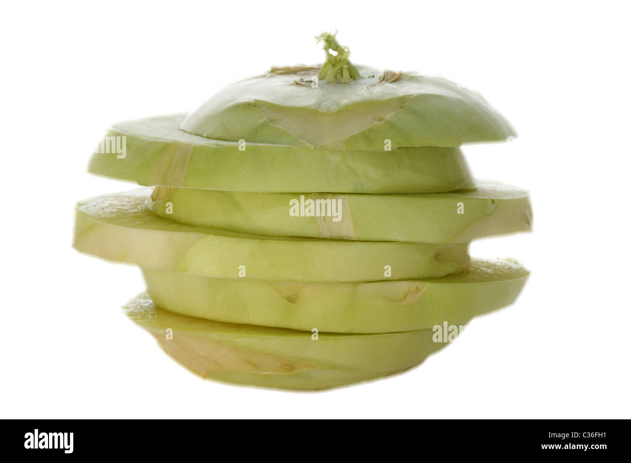 one kohlrabi cut into slices and white background Stock Photo - Alamy