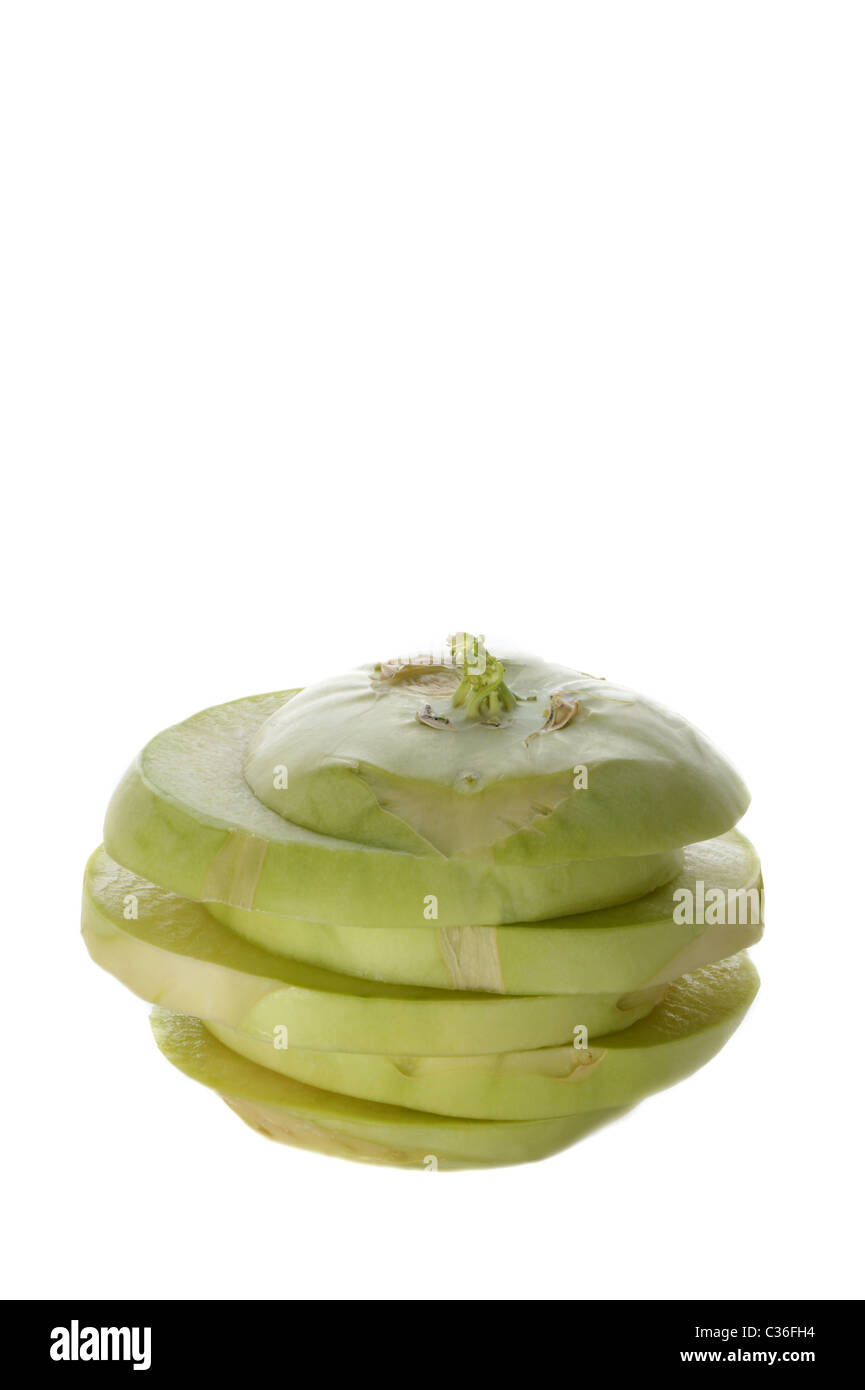 one kohlrabi cut into slices and white background Stock Photo - Alamy