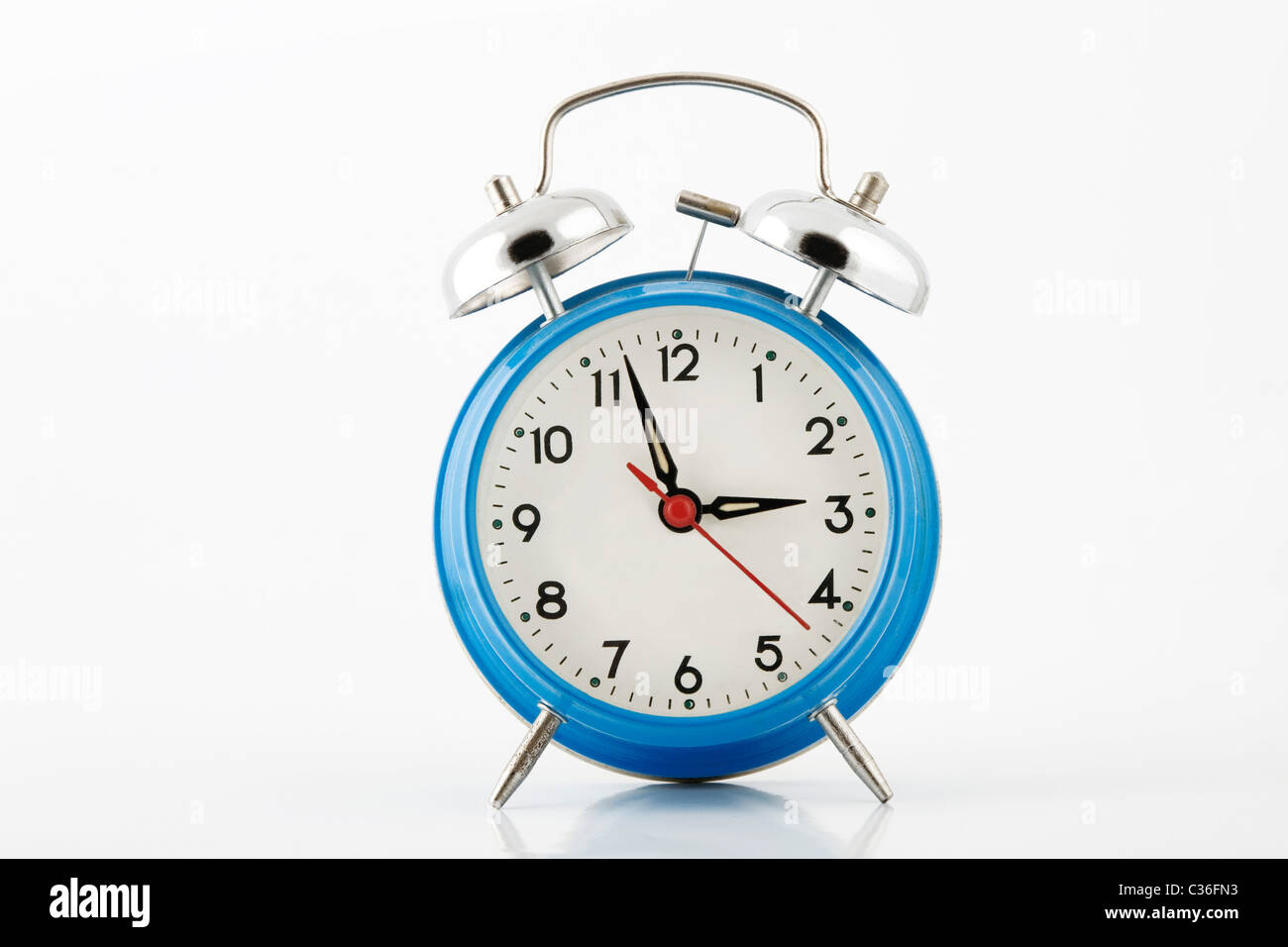 blue alarm-clock with silver bell on white background Stock Photo - Alamy