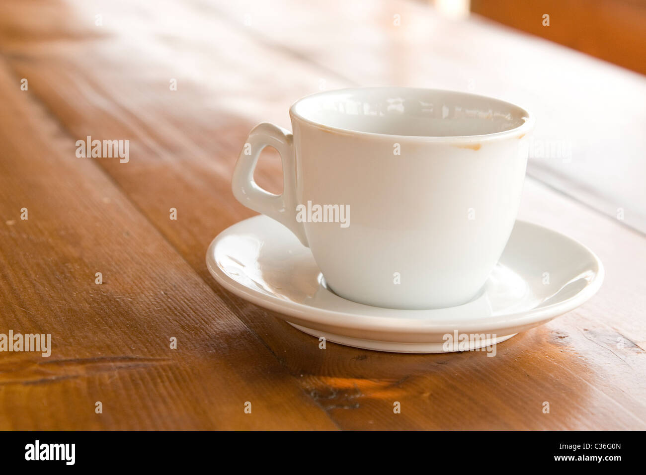 front view of coffee cup on wooden table Stock Photo - Alamy