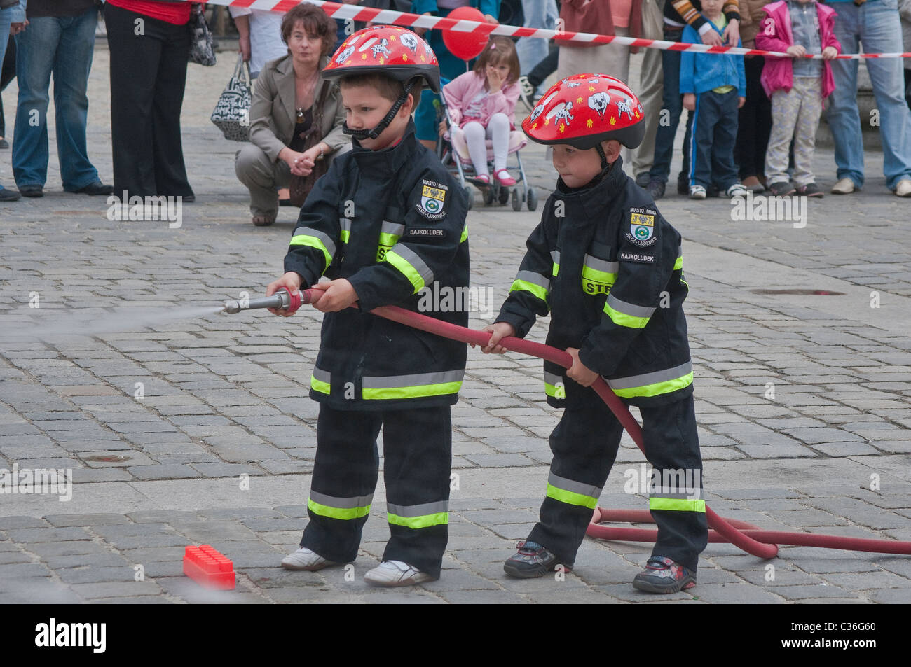 Kids spraying water at street show, Bajkoludek (Fablefolk) children ...