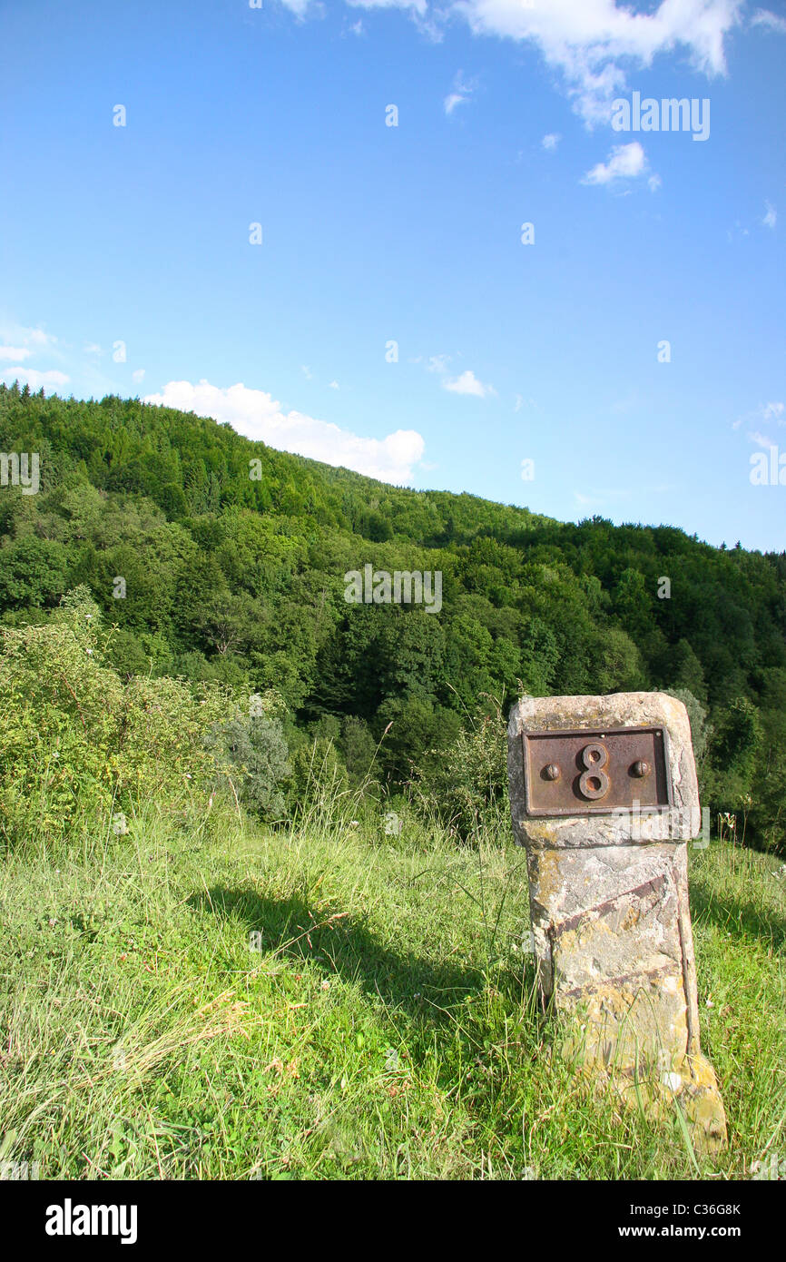 milestone marked with eight and positioned on a hill Stock Photo - Alamy