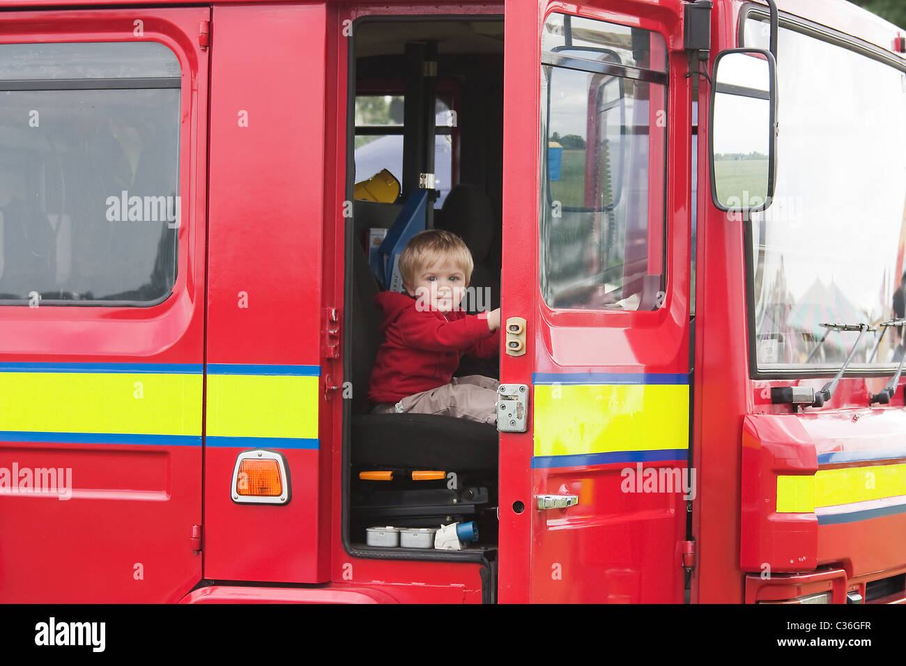 Child driving fire engine hi-res stock photography and images - Alamy