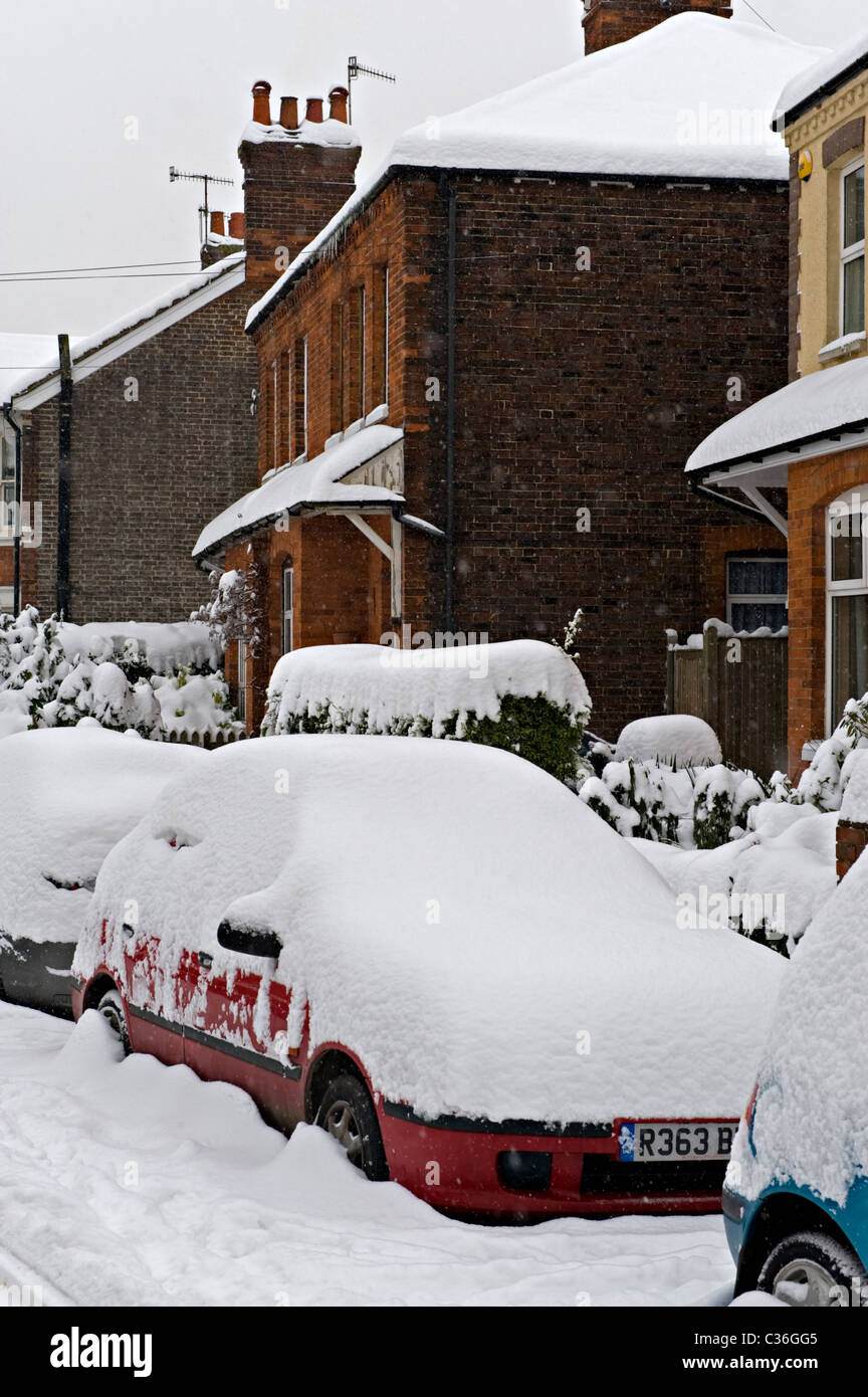 Snow Covered Street in Falling Snow Stock Photo - Alamy