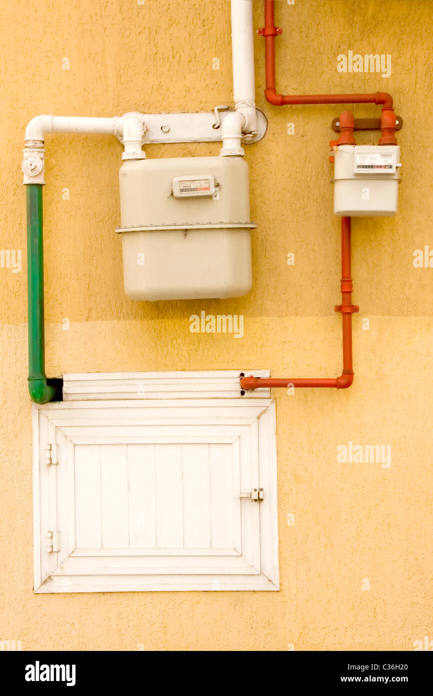 yellow wall with gas pipe and gas counter Stock Photo - Alamy
