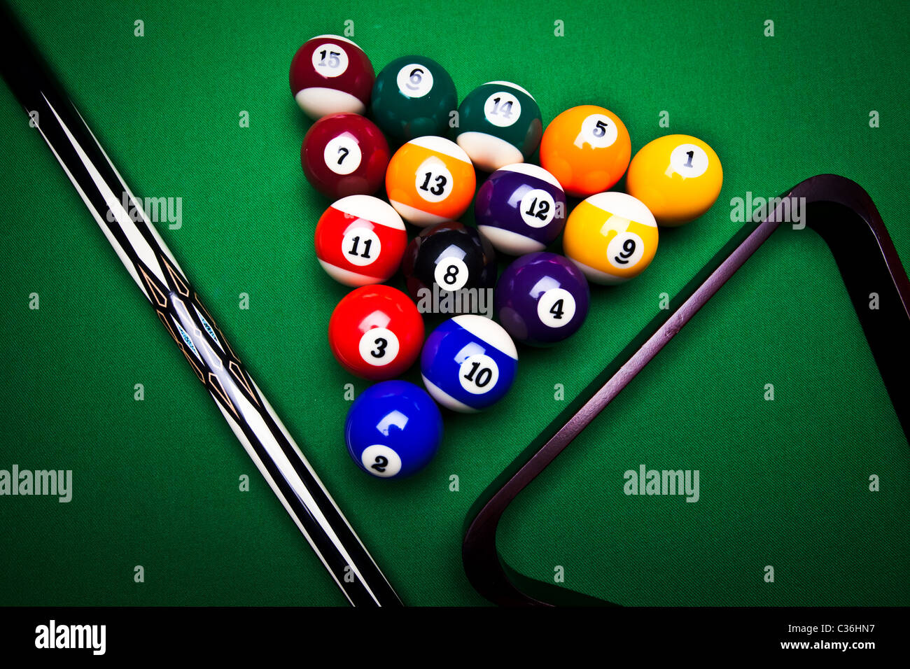 Billiard balls over green table Stock Photo - Alamy