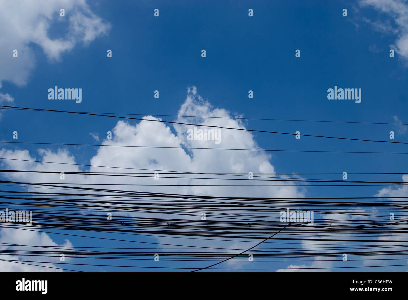 internet city cables on sky and clouds background Stock Photo - Alamy