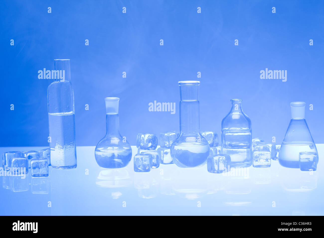 Laboratory glass in blue scenery Stock Photo - Alamy