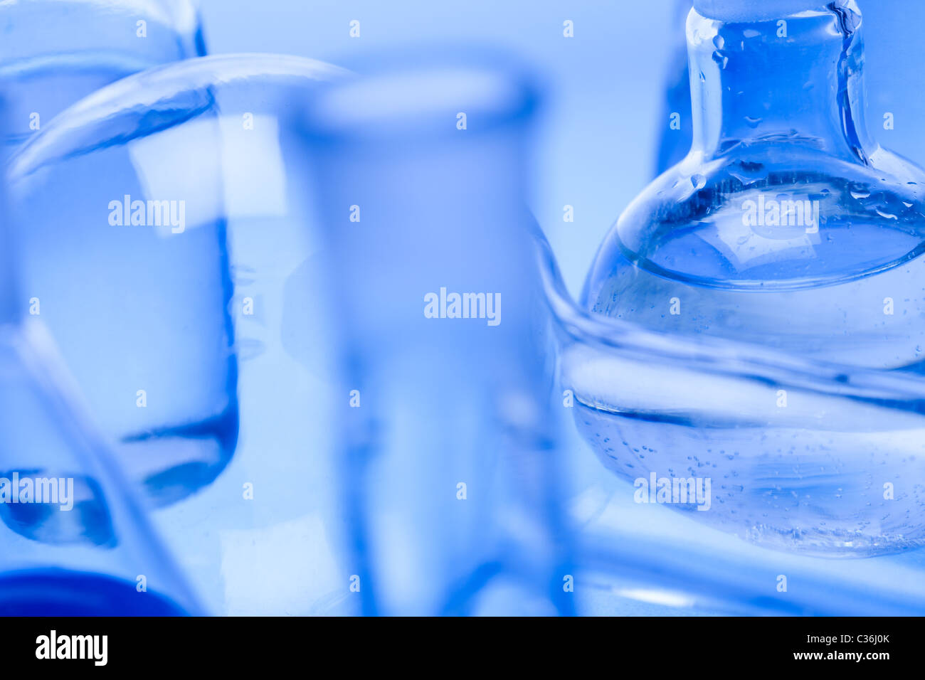 Laboratory glass in blue scenery Stock Photo - Alamy