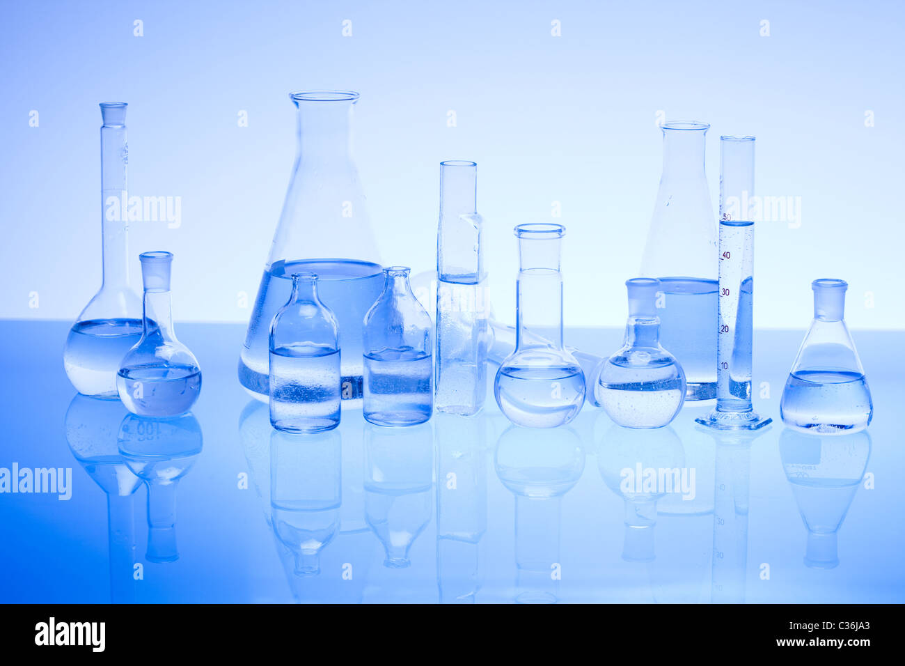 Laboratory glass in blue scenery Stock Photo - Alamy